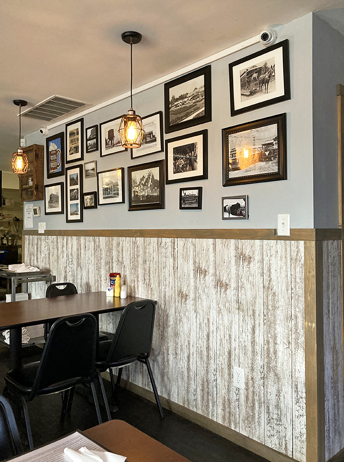 Gallery walls and weathered wood create the perfect backdrop for conversations that last longer than your coffee refills.