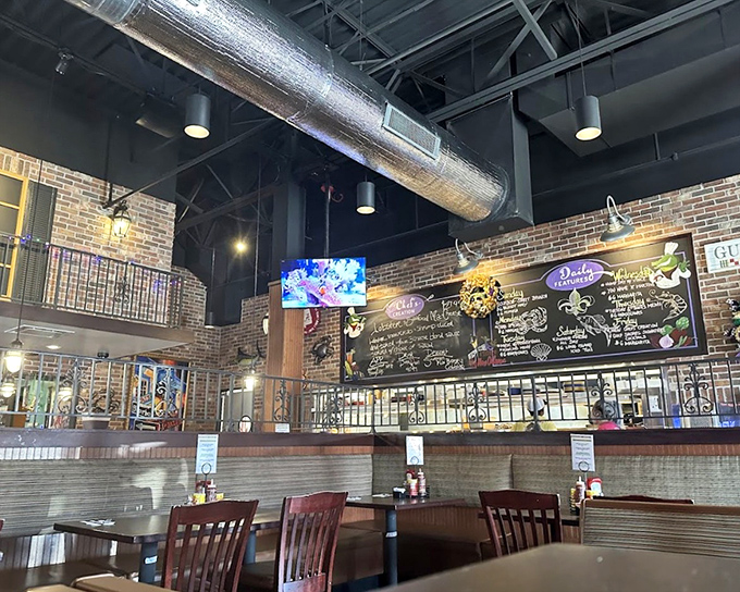 Industrial chic meets coastal comfort&mdash;exposed ductwork and brick walls create an unexpectedly perfect backdrop for seafood feasting.