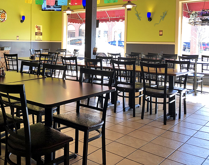 Bright yellow walls and simple furnishings create that perfect "less decor, more flavor" atmosphere where culinary magic happens without distraction.