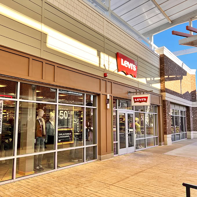 Levi's iconic storefront announces its presence with a bold "50% off" sign—denim dreams at half the nightmare price.