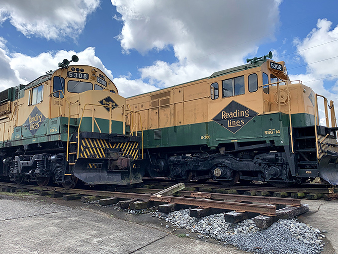 The iconic green and cream Reading Lines locomotives sit side by side, like old friends sharing stories of the rails they once conquered.