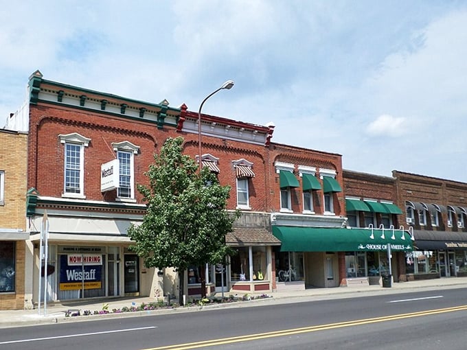 Green awnings and brick facades create the kind of Main Street that big cities spend millions trying to replicate.
