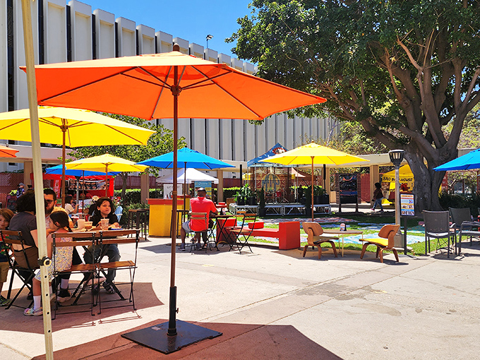 The market's layout creates natural gathering spaces where shoppers pause to refuel and compare their finds under LA's perpetually perfect sky.