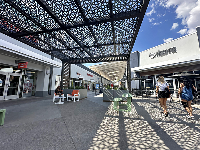 These geometric shade structures aren't just pretty&mdash;they're tactical shopping allies against the Arizona sun.