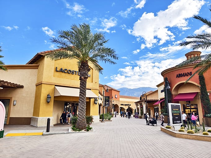 Lacoste and Armani face off across a sun-drenched plaza. It's like the United Nations of retail therapy, but with better lighting.