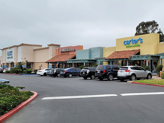 Not all heroes wear capes&mdash;some wear discount tags. This row of storefronts promises retail therapy at prices that won't require actual therapy afterward.
