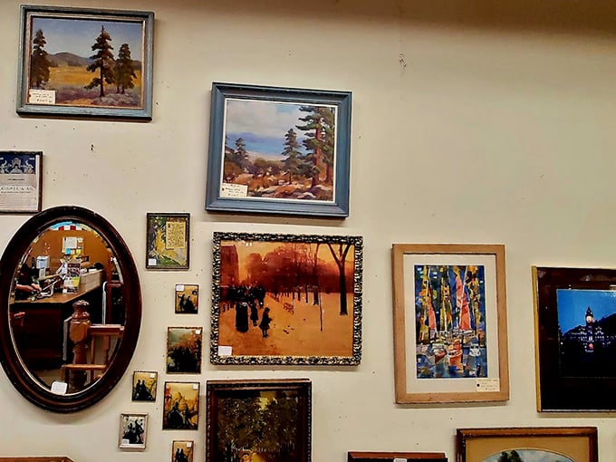 A gallery wall that would make any collector's heart skip a beat—Montana landscapes and vintage prints waiting to transform someone's living room into a conversation starter.