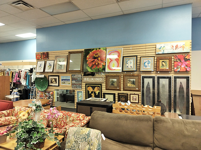 The art wall showcases everything from kitschy florals to elegant landscapes &ndash; someone's discarded decor becomes your statement piece.