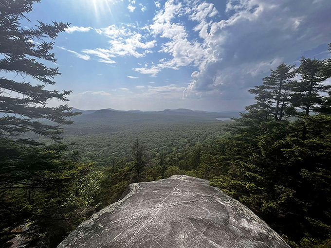 The reward for your hiking efforts. Standing on this rocky outcrop feels like being on the edge of Vermont's emerald ocean.