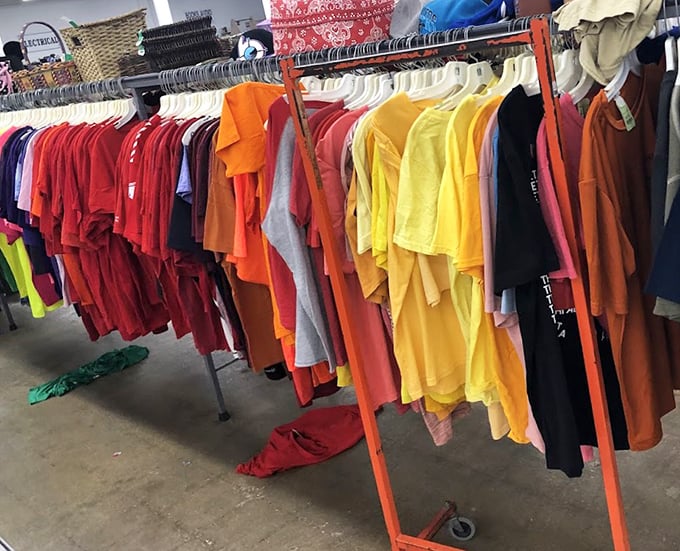 A rainbow of t-shirts awaits new owners – proof that someone else's "what was I thinking?" moment can become your wardrobe's colorful revival.