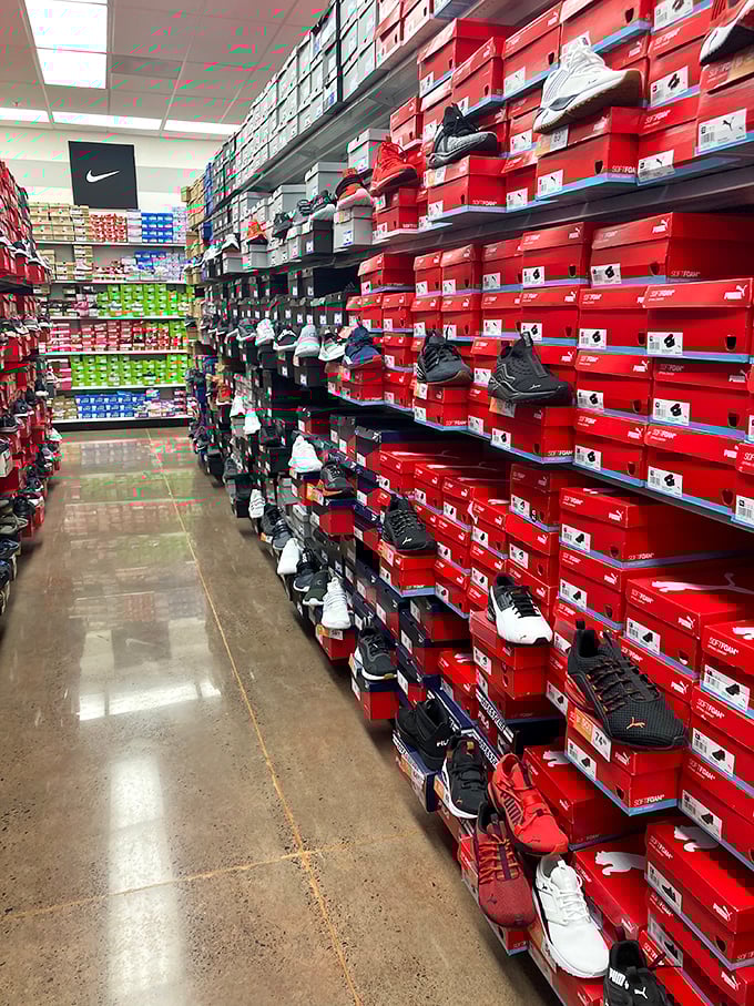 A sneakerhead's dream come true! The Nike Factory Store's wall of footwear makes choosing just one pair the day's biggest challenge.