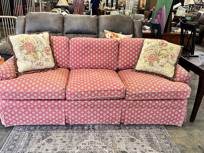 That coral sofa whispers "buy me" louder than a game show host announcing the grand prize.