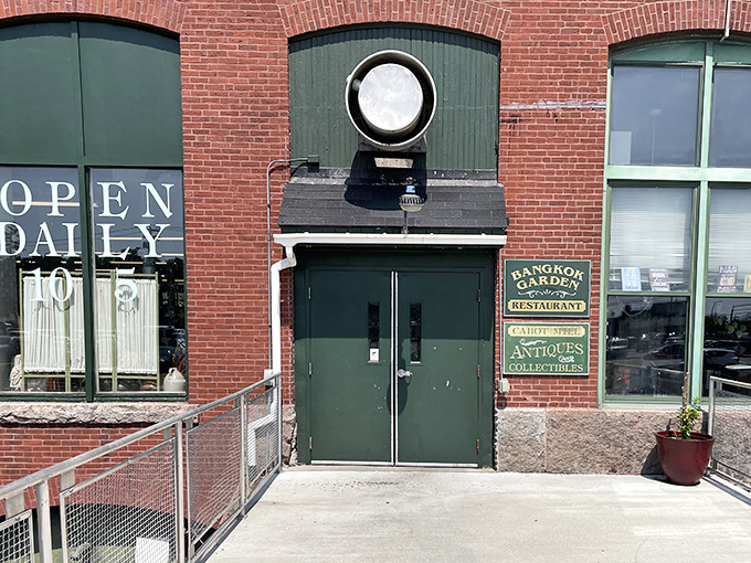 The iconic brick fa&ccedil;ade and round window above green doors promise treasures within, like a portal to Maine's collective past.