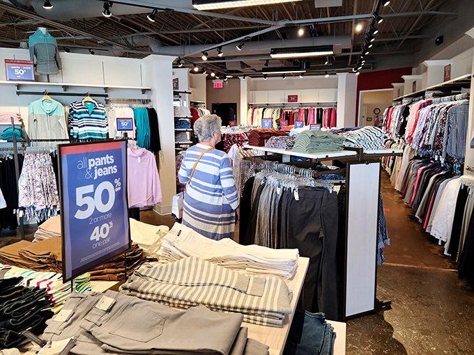 Inside, the discount signs practically glow like beacons, guiding bargain hunters toward pants at prices that won't hurt feelings.