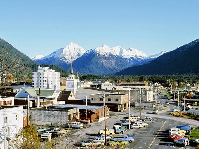 Downtown Sitka plays out like a movie set where mountains steal the scene, towering over colorful buildings with snow-capped indifference.