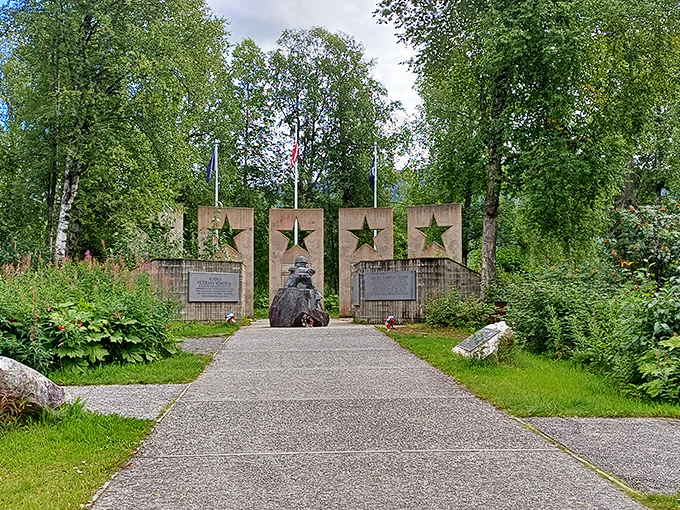 The Alaska Veterans Memorial stands as a solemn tribute amid the wilderness, reminding us that some sacrificed everything for the very freedom to explore these lands.