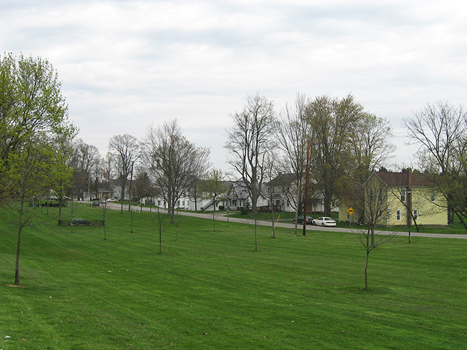 Village greens don't get much more inviting than this gentle expanse, where the grass is actually greener and your biggest decision is which tree provides the best picnic shade.