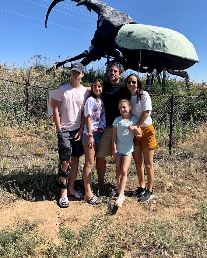 Family vacation memories that last forever: "Remember that time we posed with a beetle bigger than our SUV?"