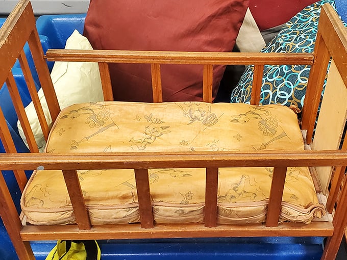 Someone's cherished childhood memory awaits its next chapter. This vintage wooden crib could star in your nursery or creative upcycling project.