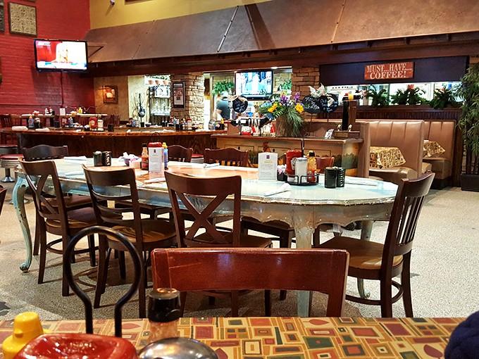 Step inside where warm colors meet comfortable seating, and your biggest decision is which table to claim as your own.