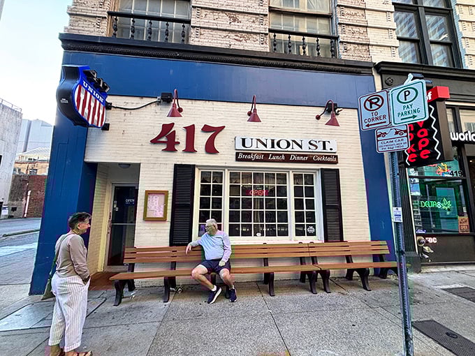 417 Union's classic blue and white facade welcomes hungry Nashville visitors with wooden benches perfect for people-watching while waiting for breakfast.