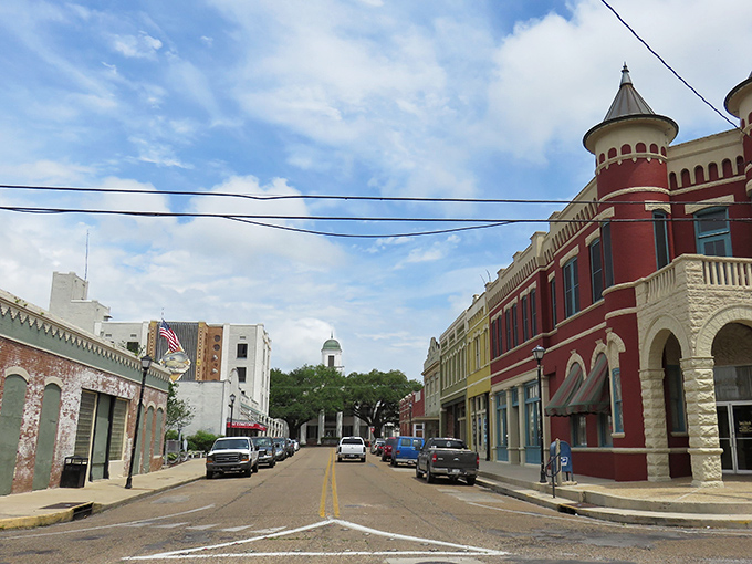 Abbeville's colorful downtown looks like a movie set where everyone knows your coffee order. That red building has serious character!