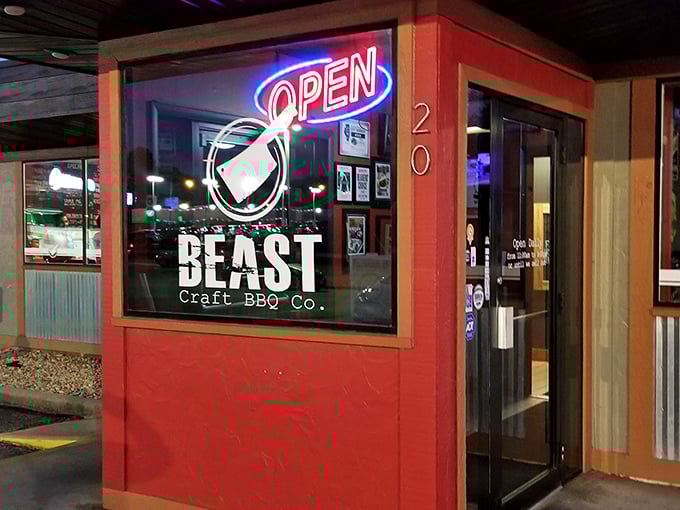 The neon glow beckons hungry souls toward Beast Craft BBQ where serious smoking happens daily and deliciously.