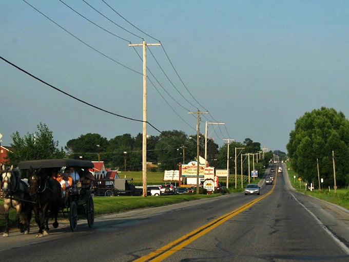 Horse-drawn buggies travel along Bird-in-Hand's main road, where visitors can experience the slower pace of Amish country.