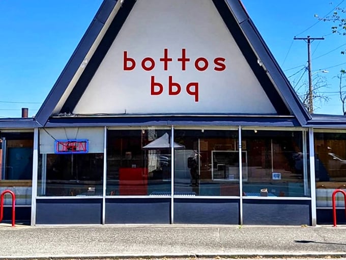 That A-frame isn't a church, but BBQ lovers still worship here. The distinctive triangle building houses smoky treasures within.