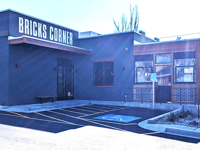 Bricks Corner's deep blue exterior stands like a quiet sentinel of pizza perfection. Detroit-style magic awaits behind those modest doors.
