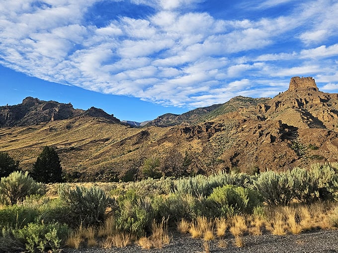 Rolling hills meet endless sky in this classic Wyoming landscape that screams "road trip destination."