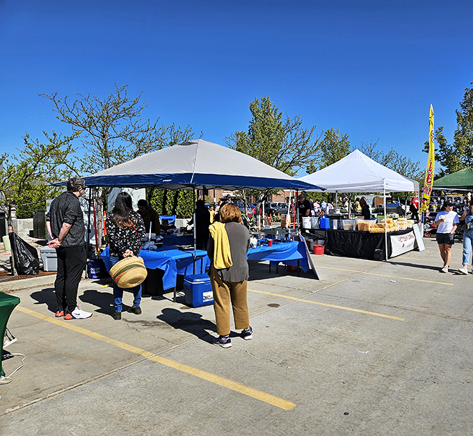 Under blue skies and white tents, Logan's market buzzes with the energy of a small-town treasure hunt.