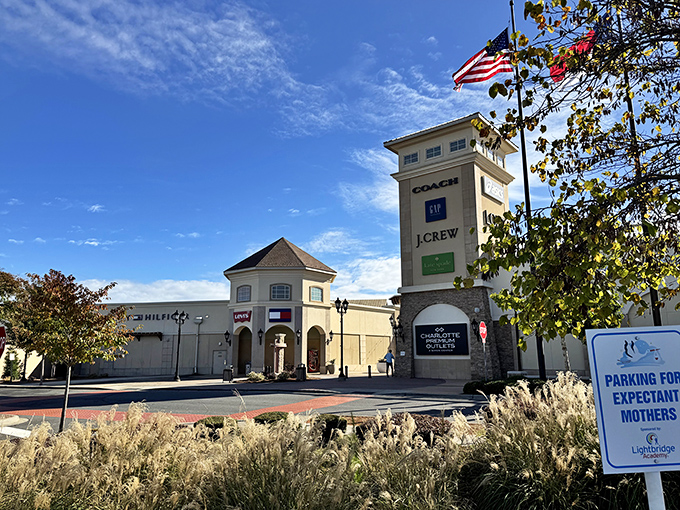 Charlotte Premium Outlets stands tall and proud, like a shopping cathedral beckoning deal-seekers with its stone facade.