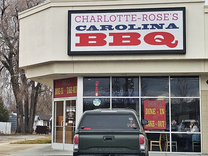 Charlotte-Rose's sign stands proud against winter trees. Carolina BBQ in Utah? It's like finding a beach in the mountains!