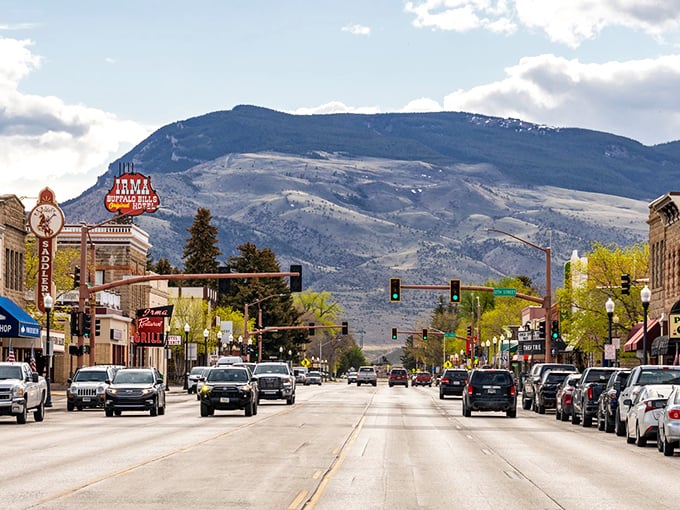 Cody's main drag rolls out the red carpet for cowboy culture with authentic Western storefronts and mountain backdrops. 