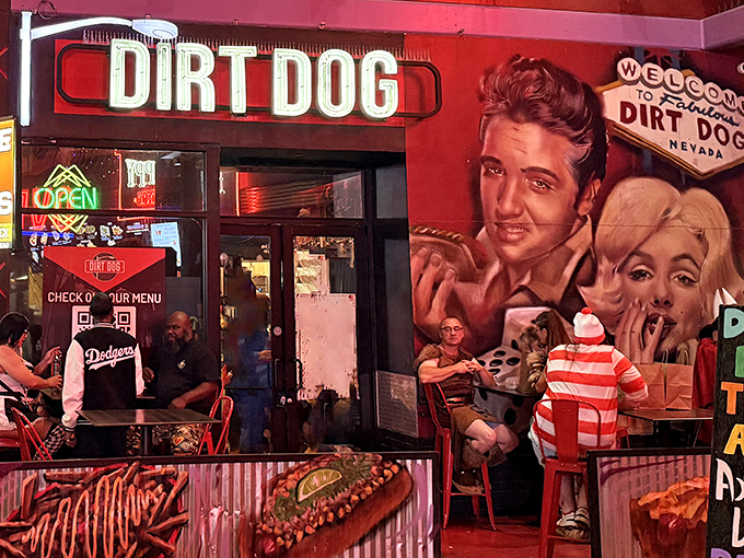 Dirt Dog's neon-lit entrance feels like stepping into a rock concert where hot dogs are the headlining act.