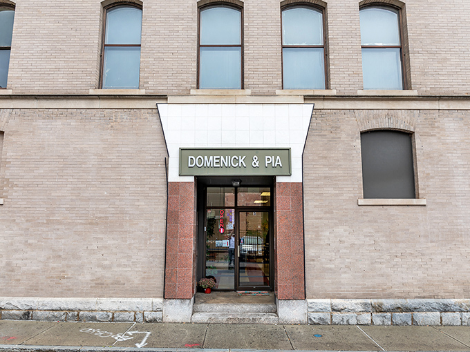 Domenick & Pia's unassuming entrance is pizza's equivalent of Clark Kent's glasses. Behind that simple sign lies superhero-level thin crust magic.