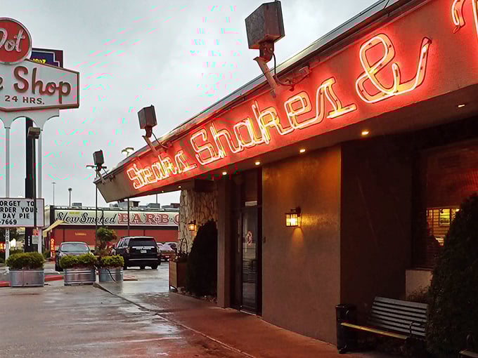 Dot Coffee Shop's glowing neon sign cuts through Houston's night like a beacon for hungry souls seeking comfort food salvation.