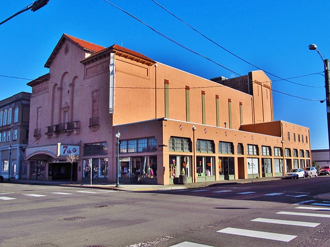 Hoquiam's 7th Street Theatre stands as a peachy-pink landmark against the blue sky. Like a grand old dame dressed in her Sunday best, still turning heads!