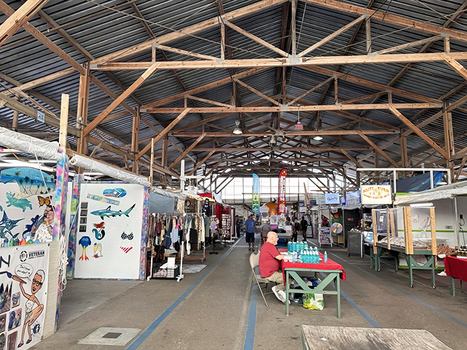 Under this soaring wooden ceiling, vendors have arranged their wares like an indoor bazaar where discoveries await around every corner.