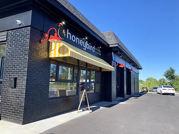 Honeybird's modern black building with sunny yellow accents &ndash; where fried chicken gets dressed up for a night on the town.