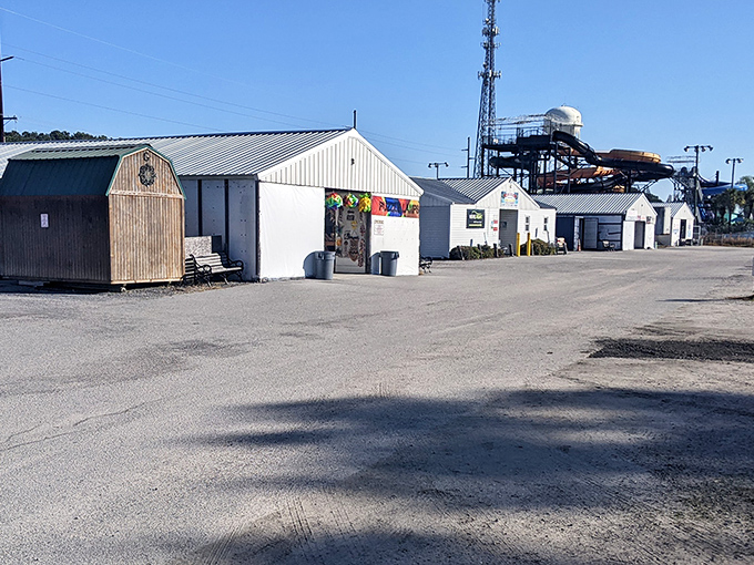 Hudson's Surfside Flea Market features simple white buildings where beach-themed treasures and everyday bargains await shoppers near the coast.