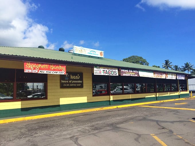 Bright yellow exterior that screams "pancakes happen here!" with a sign that might as well say "abandon diets, all ye who enter."