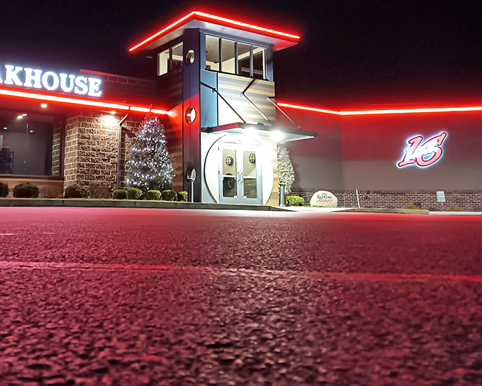 Lock Sixteen's neon glow cuts through the night like a beacon. This roadside gem has been calling to steak lovers for generations.