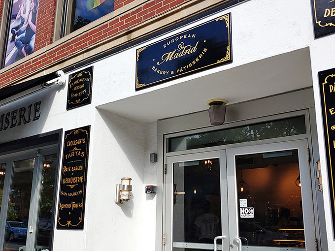 Madrid's elegant blue and gold signage promises European sophistication in every buttery, flaky bite.