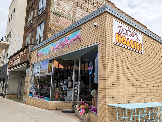 The colorful Magic City Hoagies storefront beckons like a sandwich oasis in downtown Minot. That rainbow sign promises good things inside!