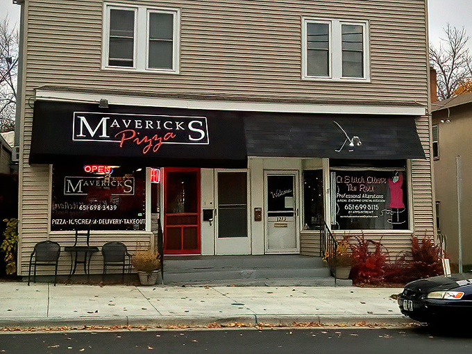 Mavericks Pizza's bold black awning and red door create the perfect storefront for this beloved St. Paul institution.