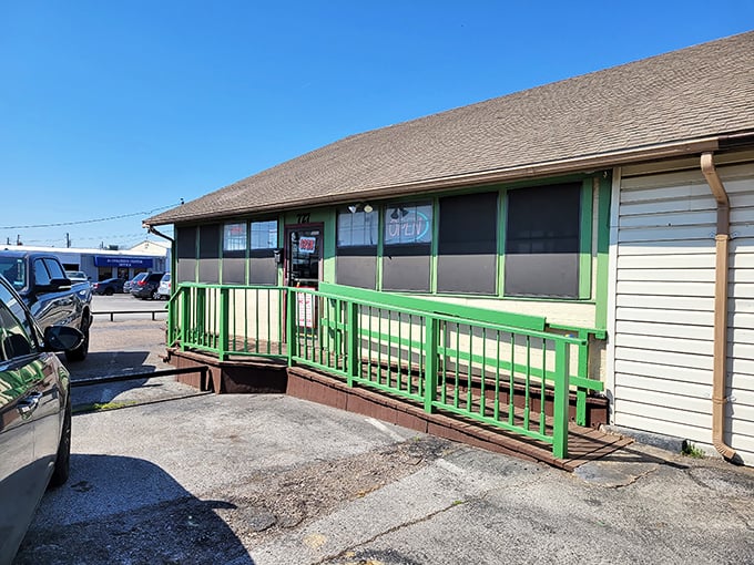 Mill Street Diner's charming exterior features bright green railings and a welcoming entrance, promising homestyle comfort food inside.