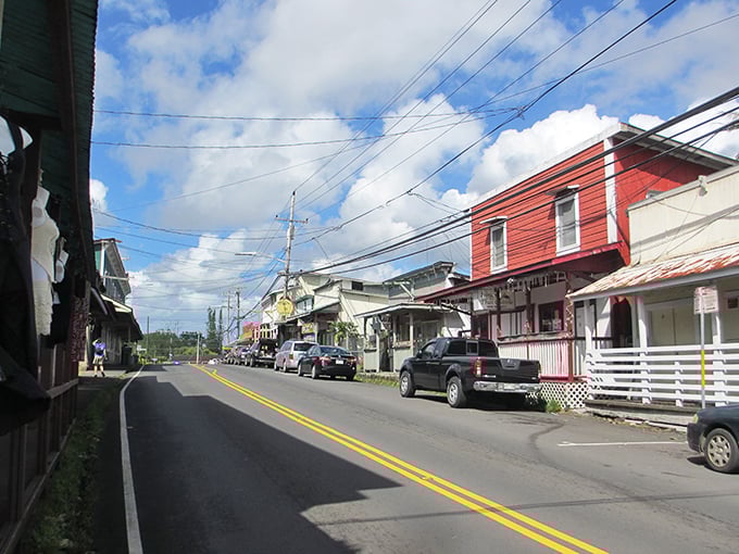 Small-town magic flows through Pāhoa's main street, where wooden buildings whisper stories of old Hawaii between passing cars.