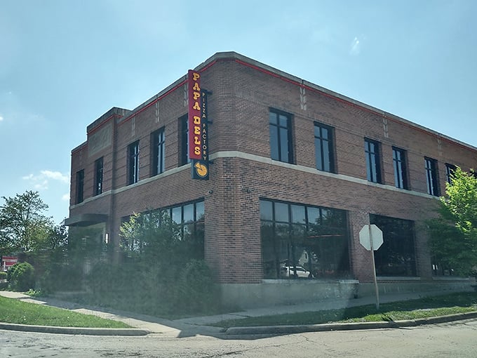 Papa Del's brick building stands like a pizza fortress, guarding Champaign's most beloved deep dish secret.